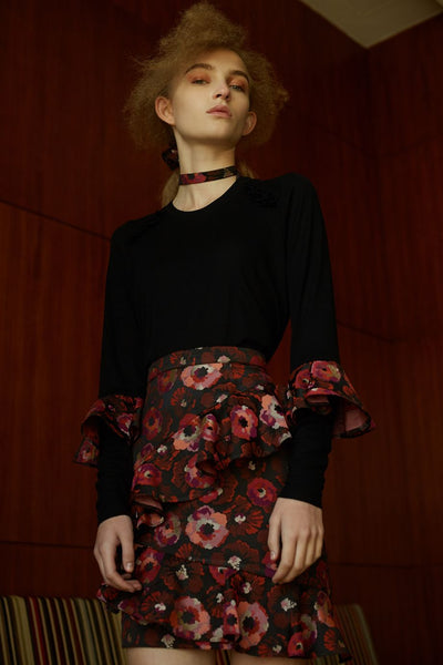 Skirt. High waisted. It is fitted around the hip and has asymmetrical ...